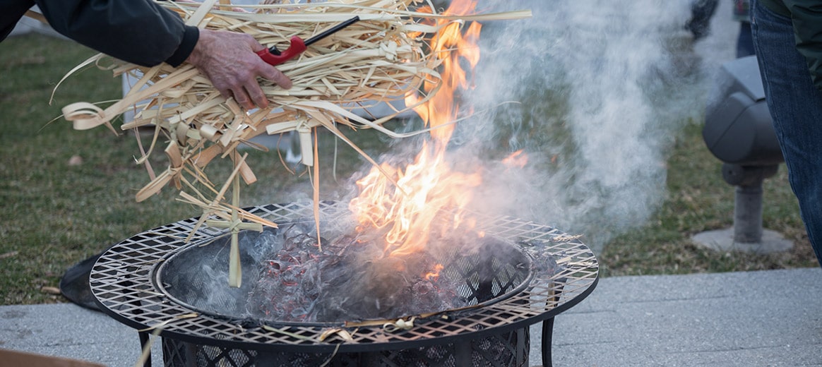 Burning palms for Ash Wednesday - Arlington Catholic Herald